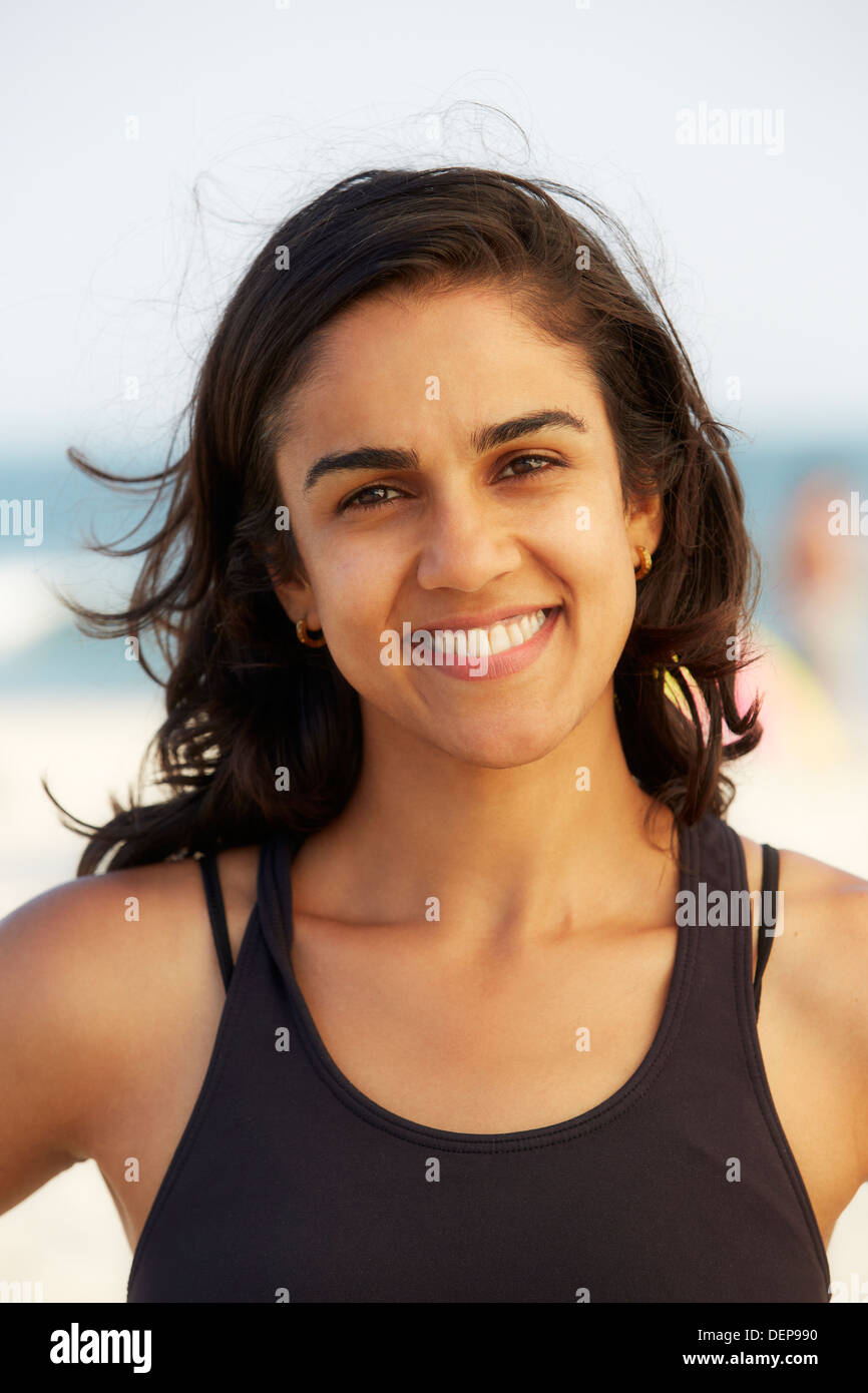 Asian woman smiling on beach Stock Photo - Alamy