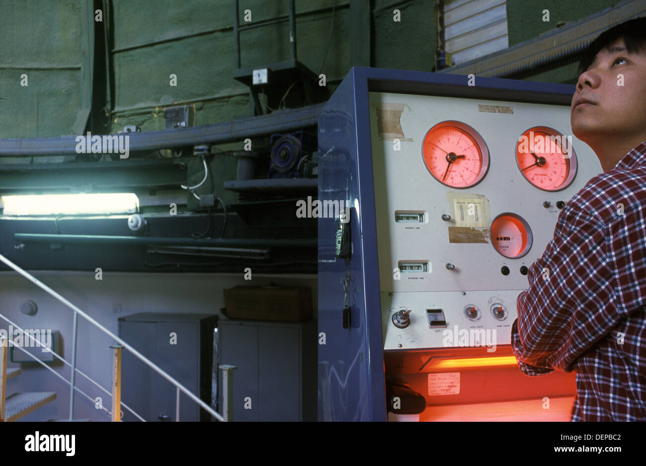 A Chinese astronomer operating an astronomical telescope at the ...