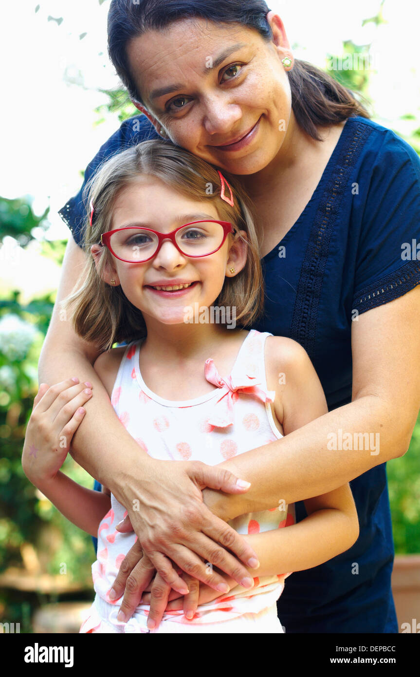 Woman hugging daughter hi-res stock photography and images - Alamy