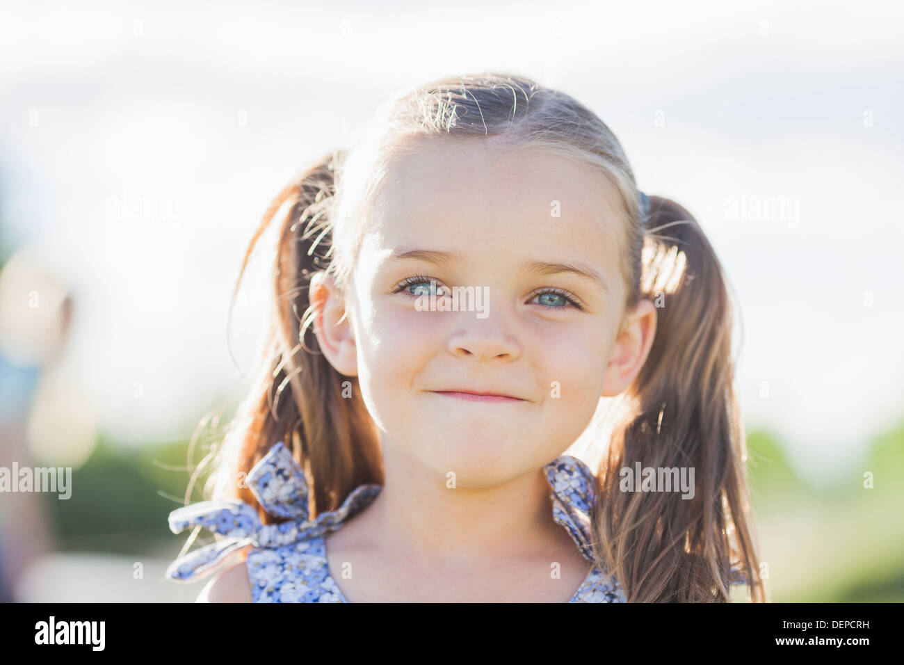Caucasian girl smiling outdoors Stock Photo - Alamy