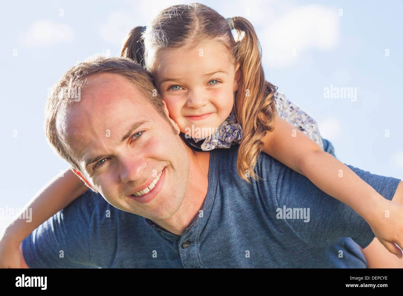 Father carrying daughter on shoulders hi-res stock photography and images - Alamy