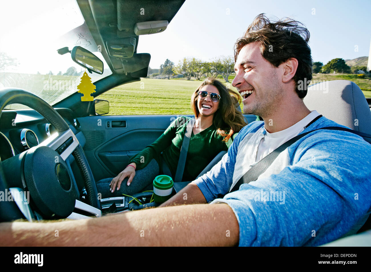 Couple driving in convertible Stock Photo - Alamy