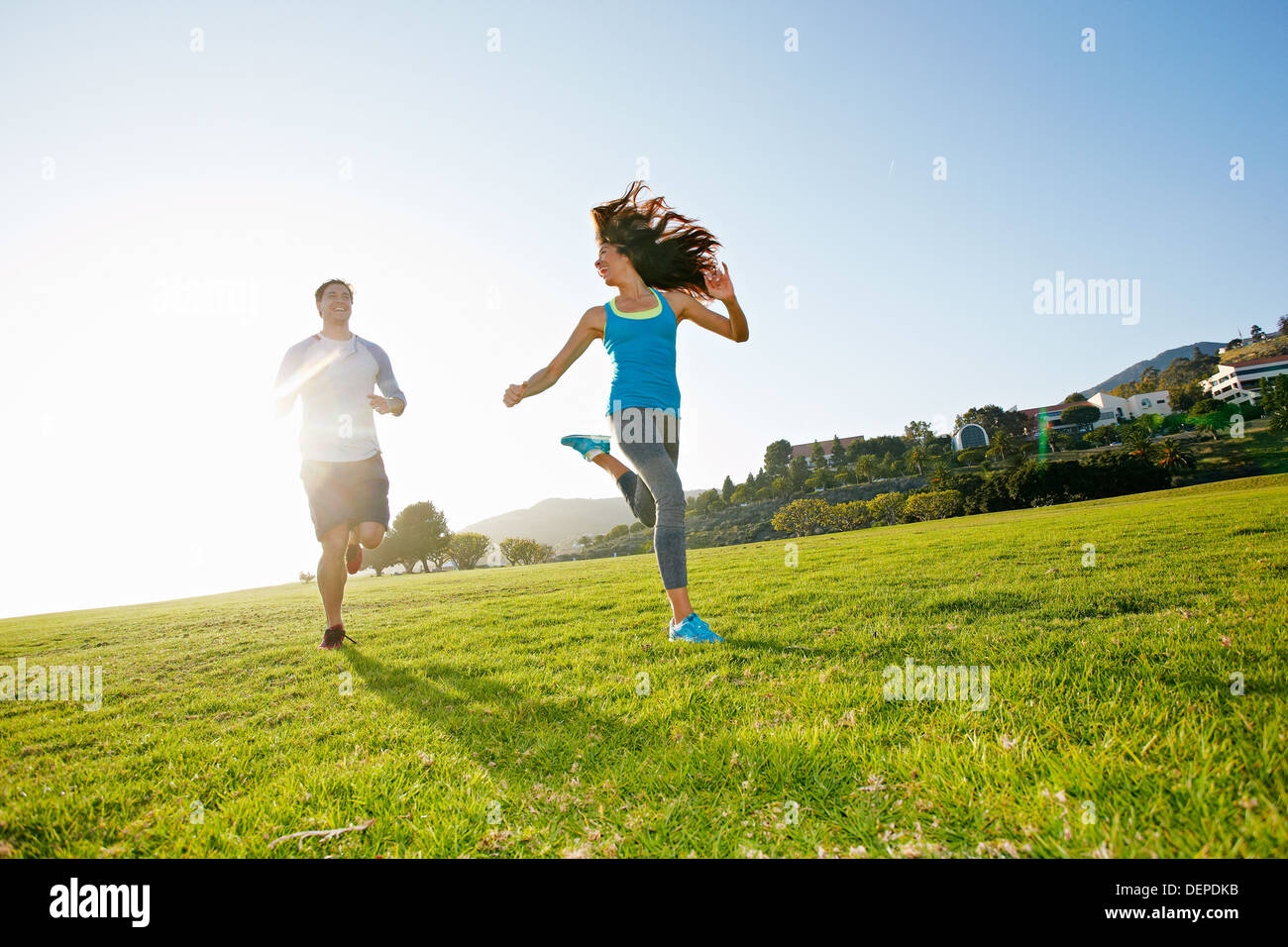 Adult group running in park hi-res stock photography and images - Alamy