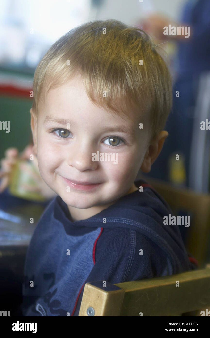 3 year old boy at nursery smiling into camera hi-res stock photography ...