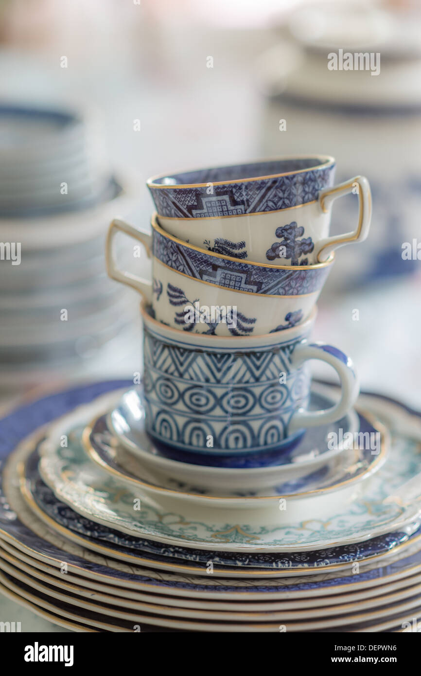 blue and white china cups stacked with plates Stock Photo - Alamy