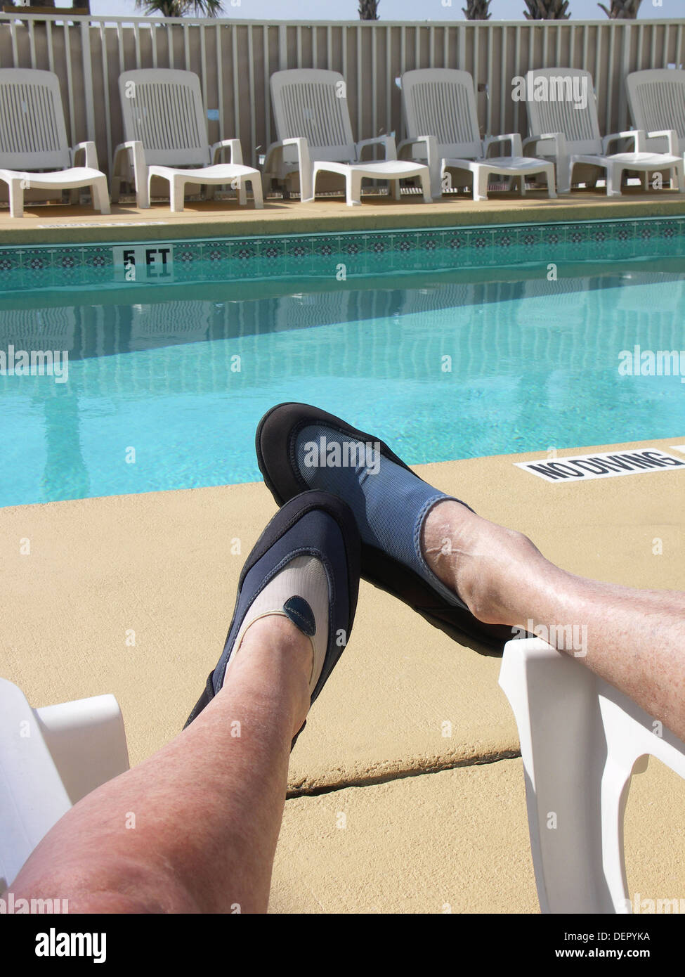 Couple in water shoes touching hi-res stock photography and images - Alamy