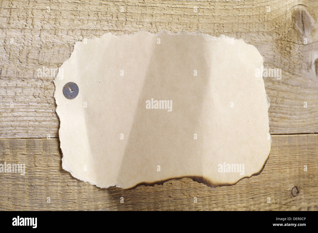 Blank sheet of old torn paper on a wooden background Stock Photo - Alamy