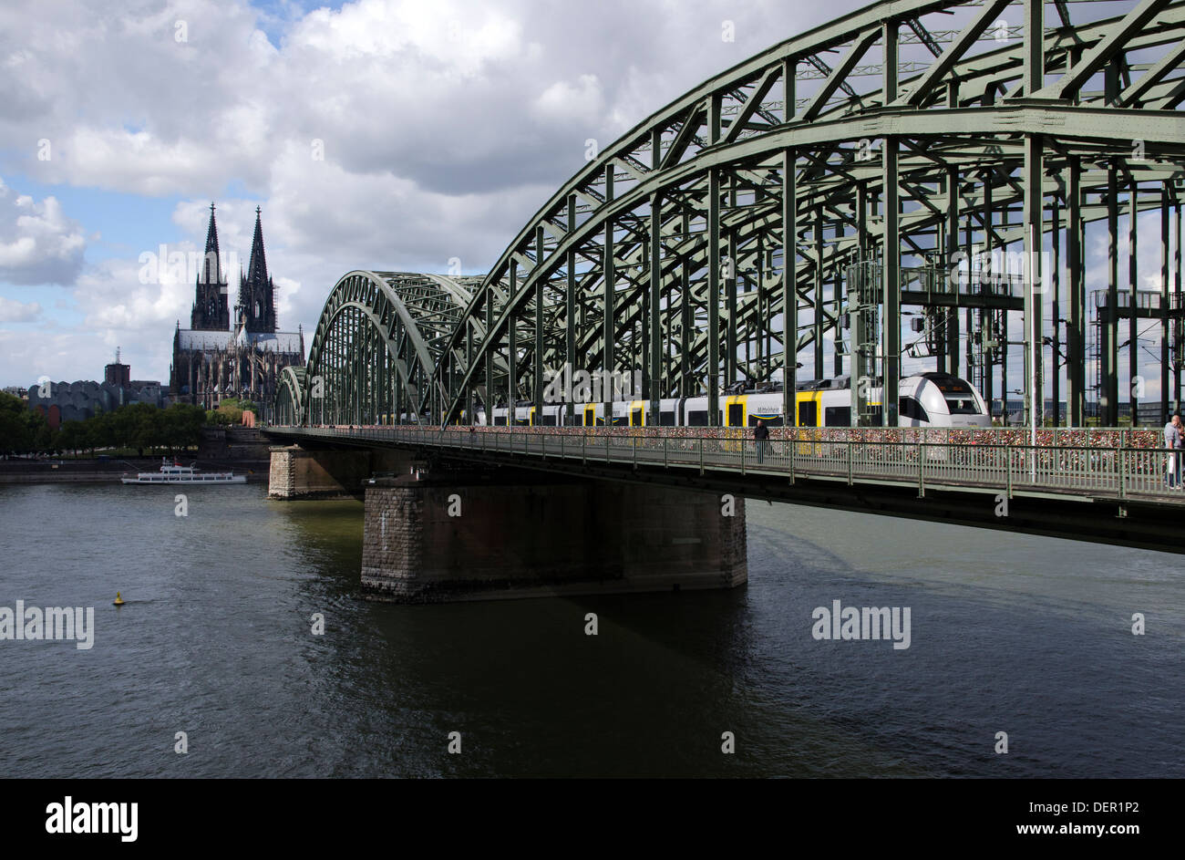 main railway bridge over the rhine at cologne germany with cathedral in ...