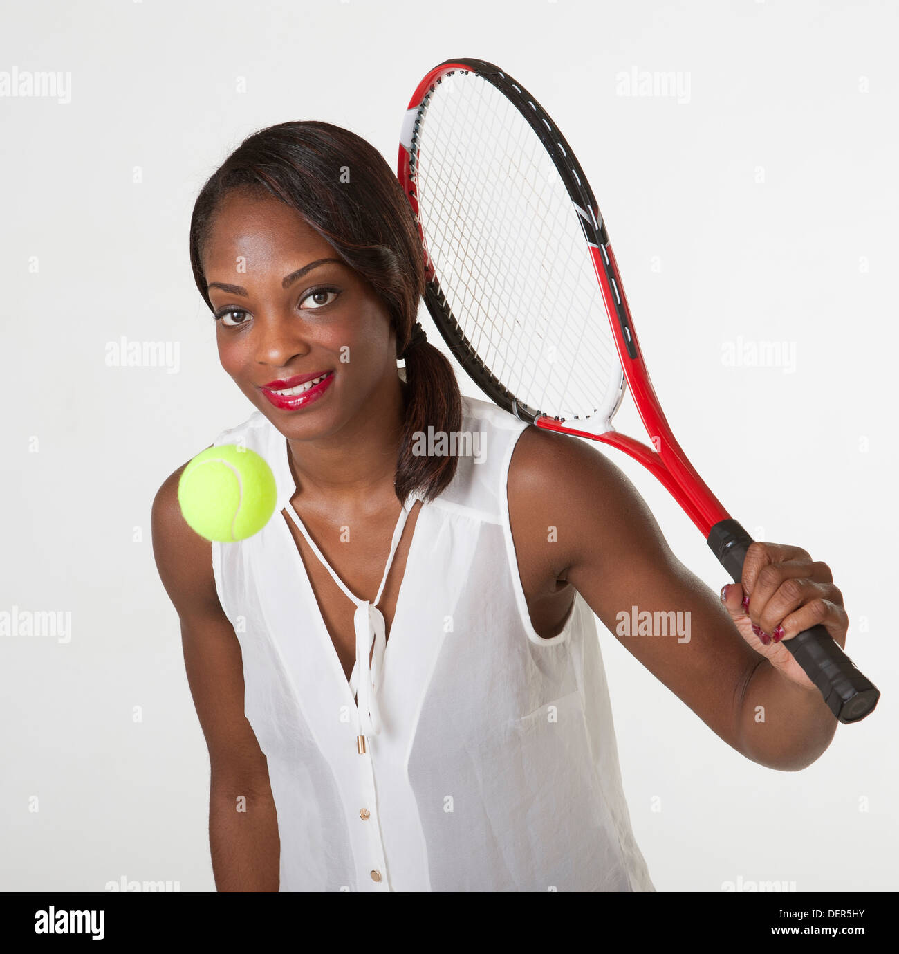 Young black woman playing tennis Stock Photo - Alamy