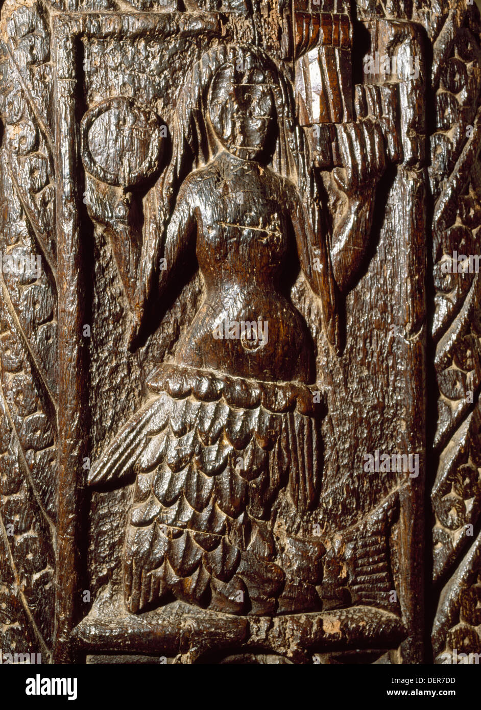 Zennor Mermaid legend: carving of a mermaid with a comb and looking ...