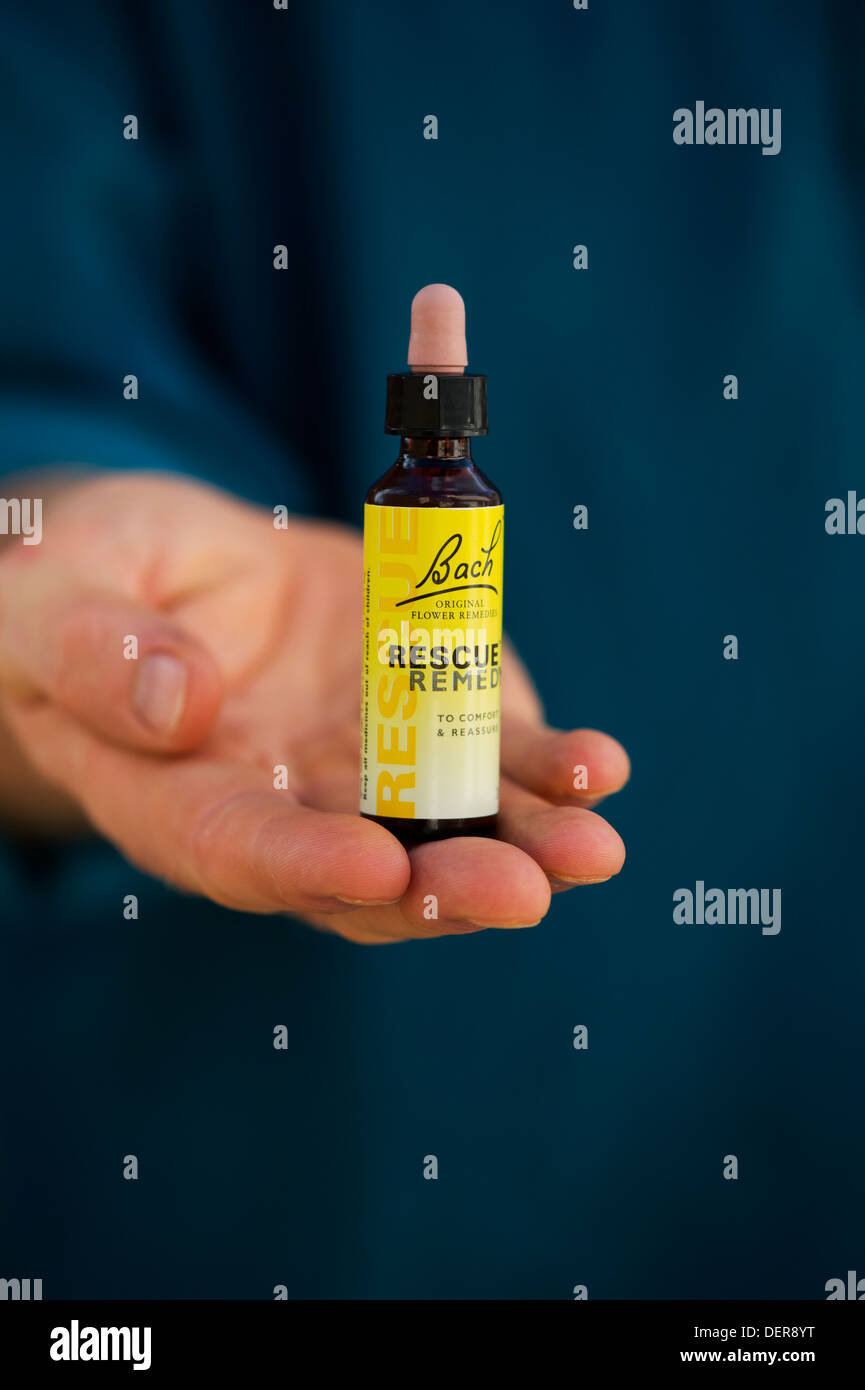 Hand holding a bottle of Bach flower essence. Rescue Remedy Stock Photo ...