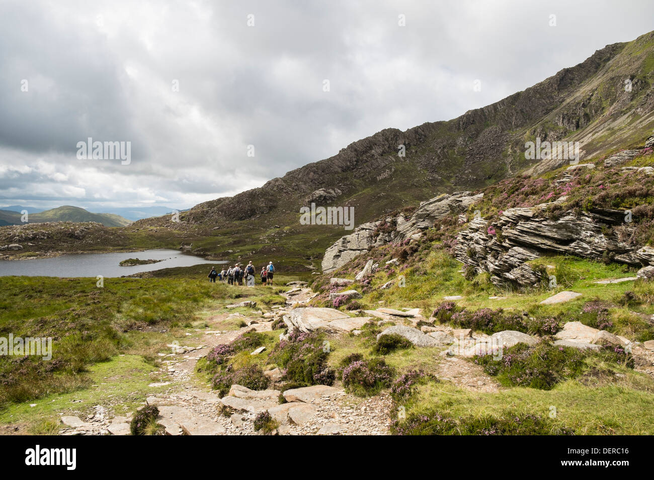 Path to Carnedd Moel Siabod with walkers near Llyn y Foel lake ...