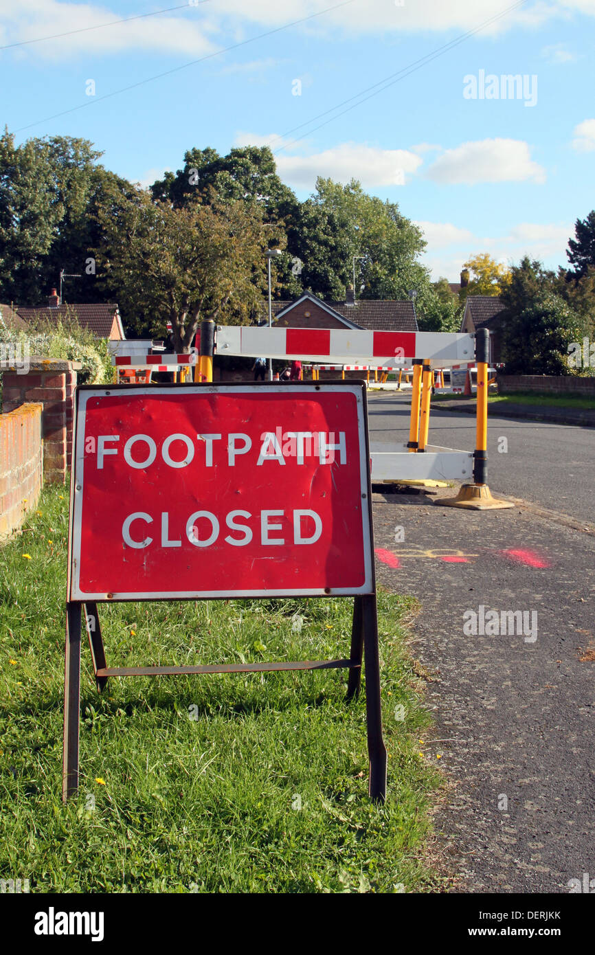 Road work warning signs and barriers in a street in England Stock Photo ...