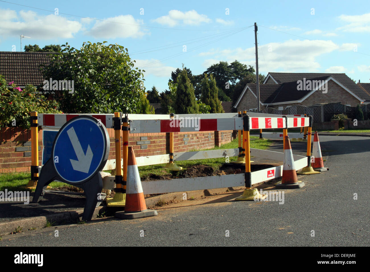 Road work warning signs and barriers in a street in England Stock Photo ...