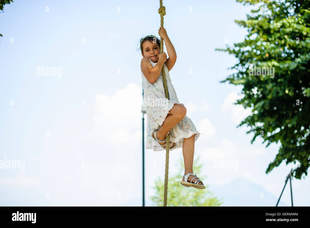 Girl climbing rope hi-res stock photography and images - Alamy
