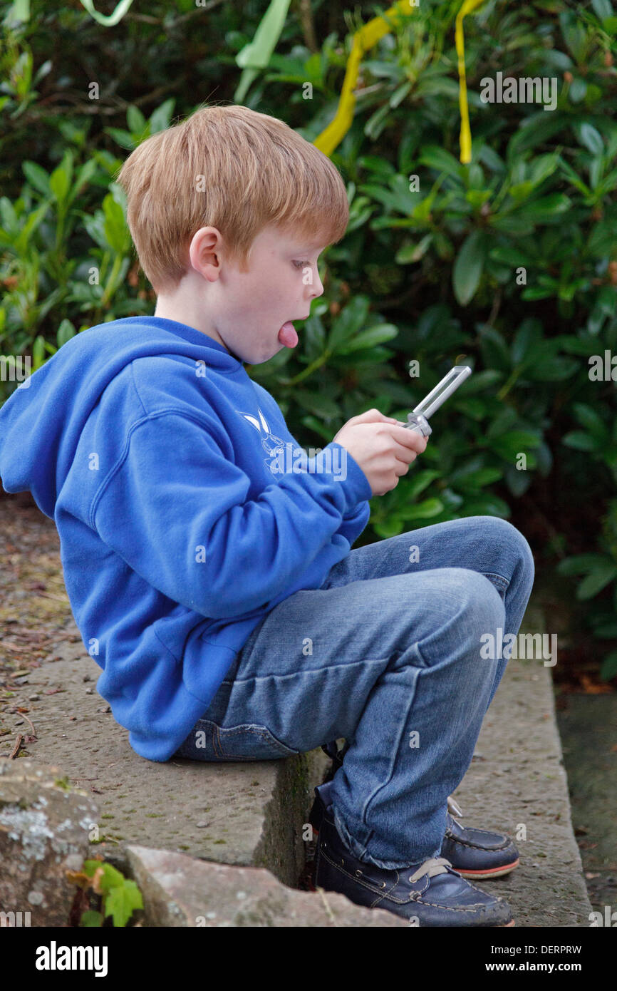 young boy playing Nintendo Stock Photo - Alamy