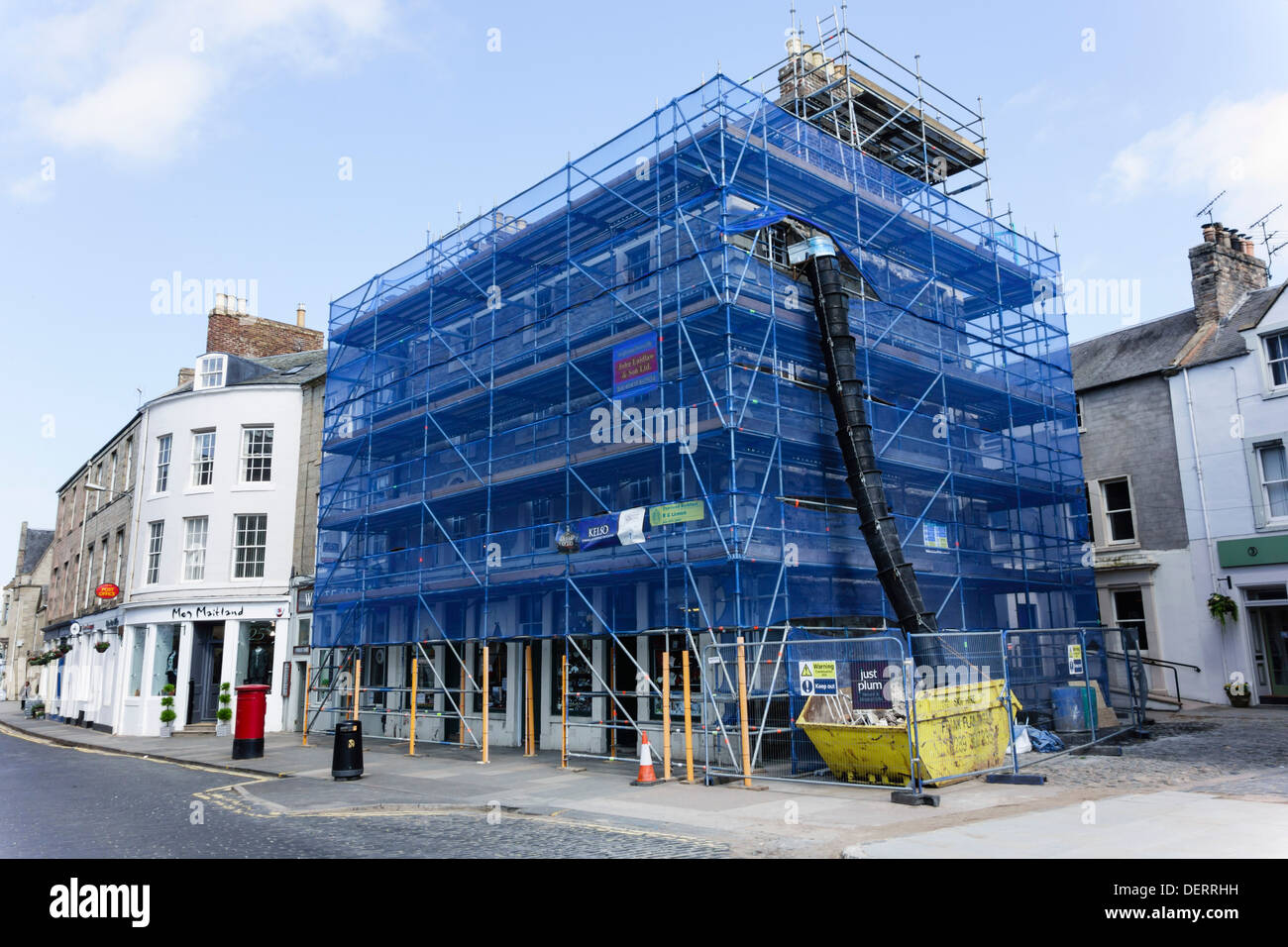 Blue protection netting surrounds an 18th century property being ...