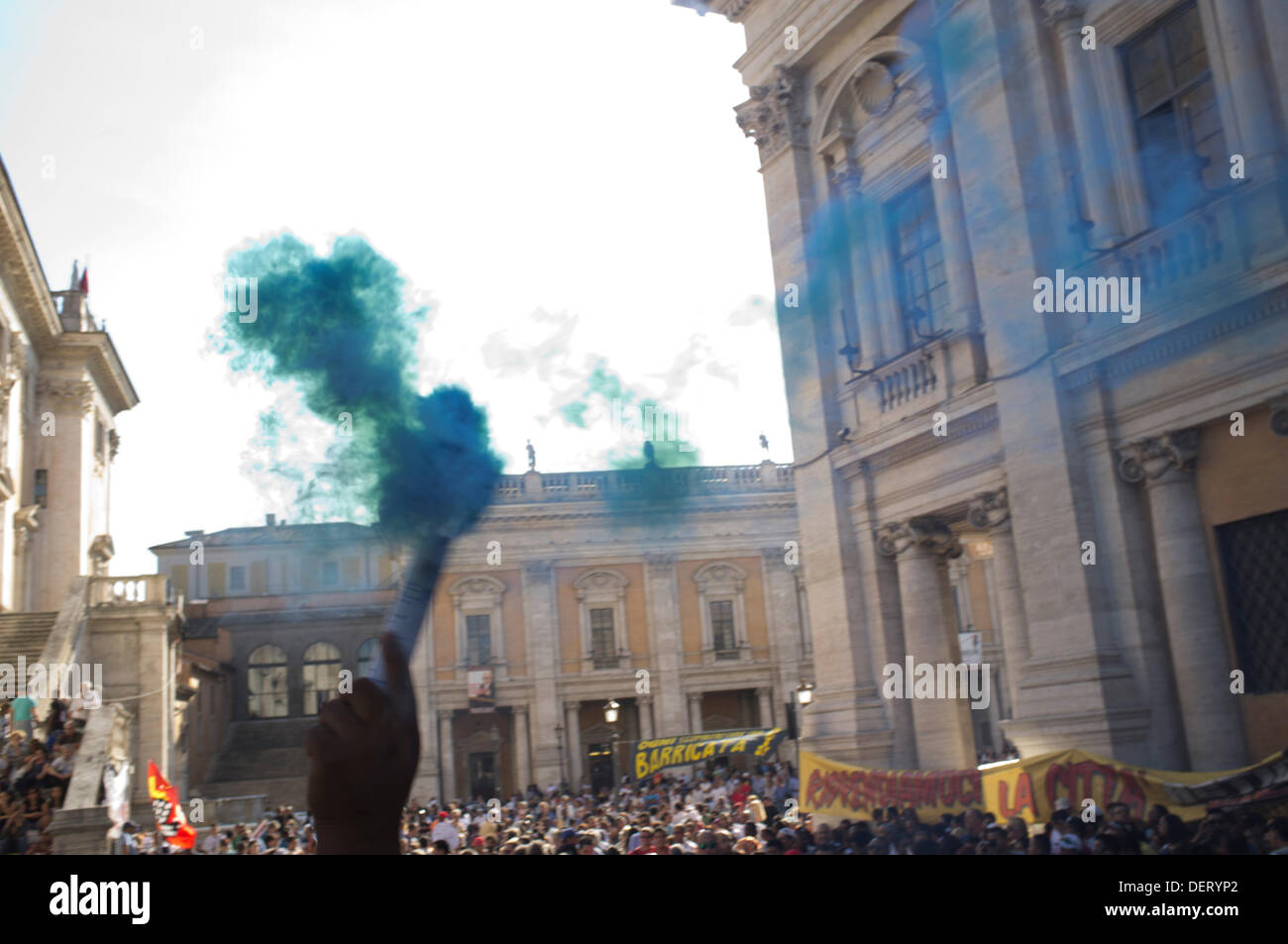 Rome Italy. 23rd Sep, 2013. A protester lights a smoke flare as ...
