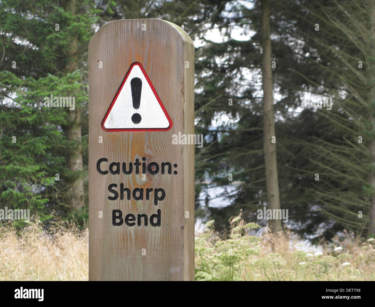 Warning Sign for a Dangerous Sharp Bend on a Mountain Biking Trail, UK ...
