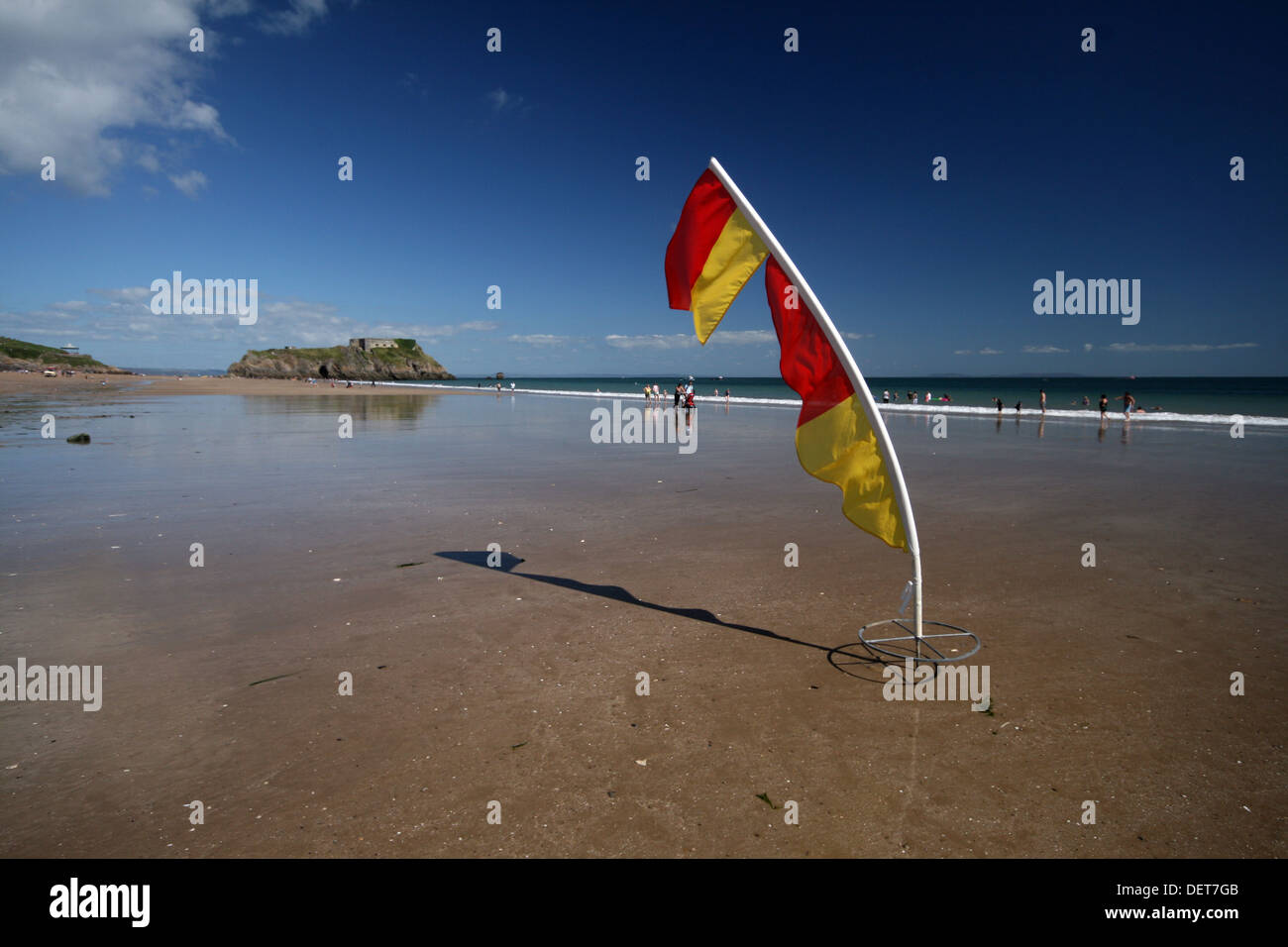 A lifeguard's flag tells swimmers it's okay to swim in the sea at Tenby ...