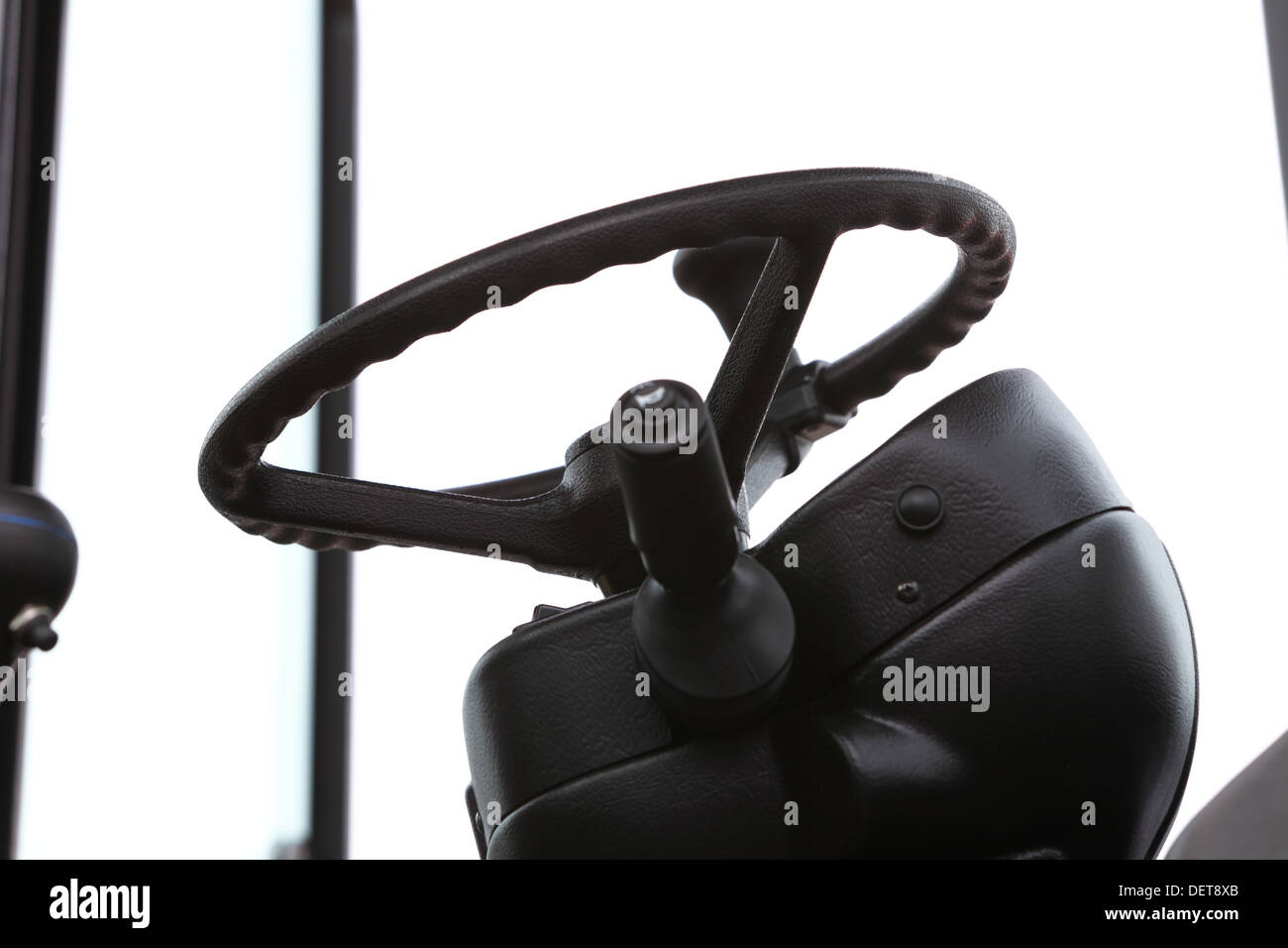Steering wheel in interior of a new industrial machine Stock Photo - Alamy