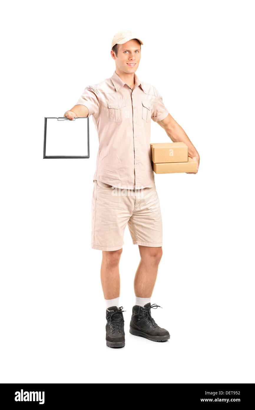 Full length portrait of a delivery boy holding a packet and giving a ...