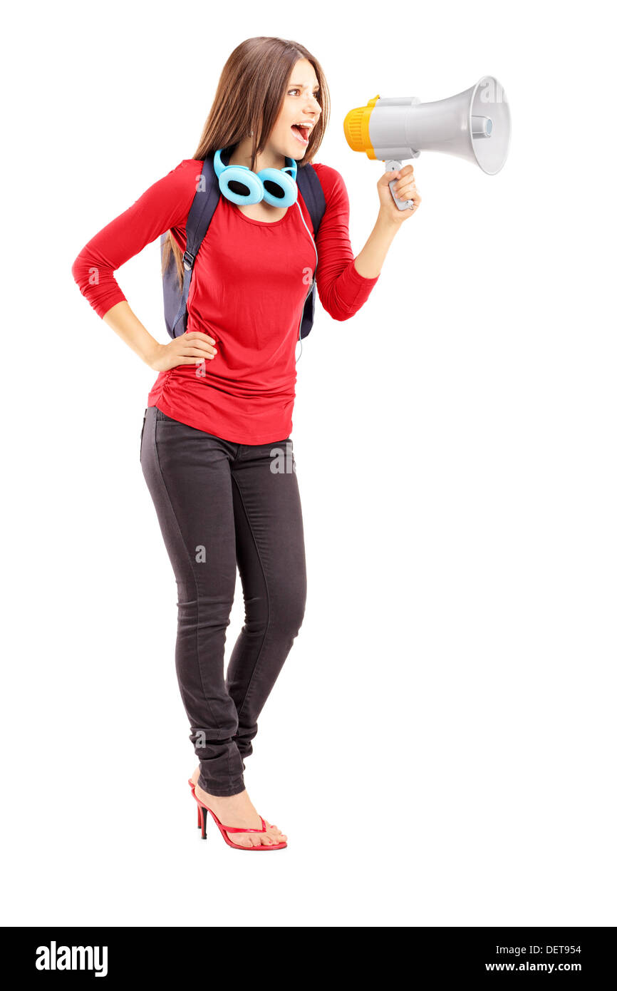 Full length portrait of a female student shouting via megaphone Stock ...