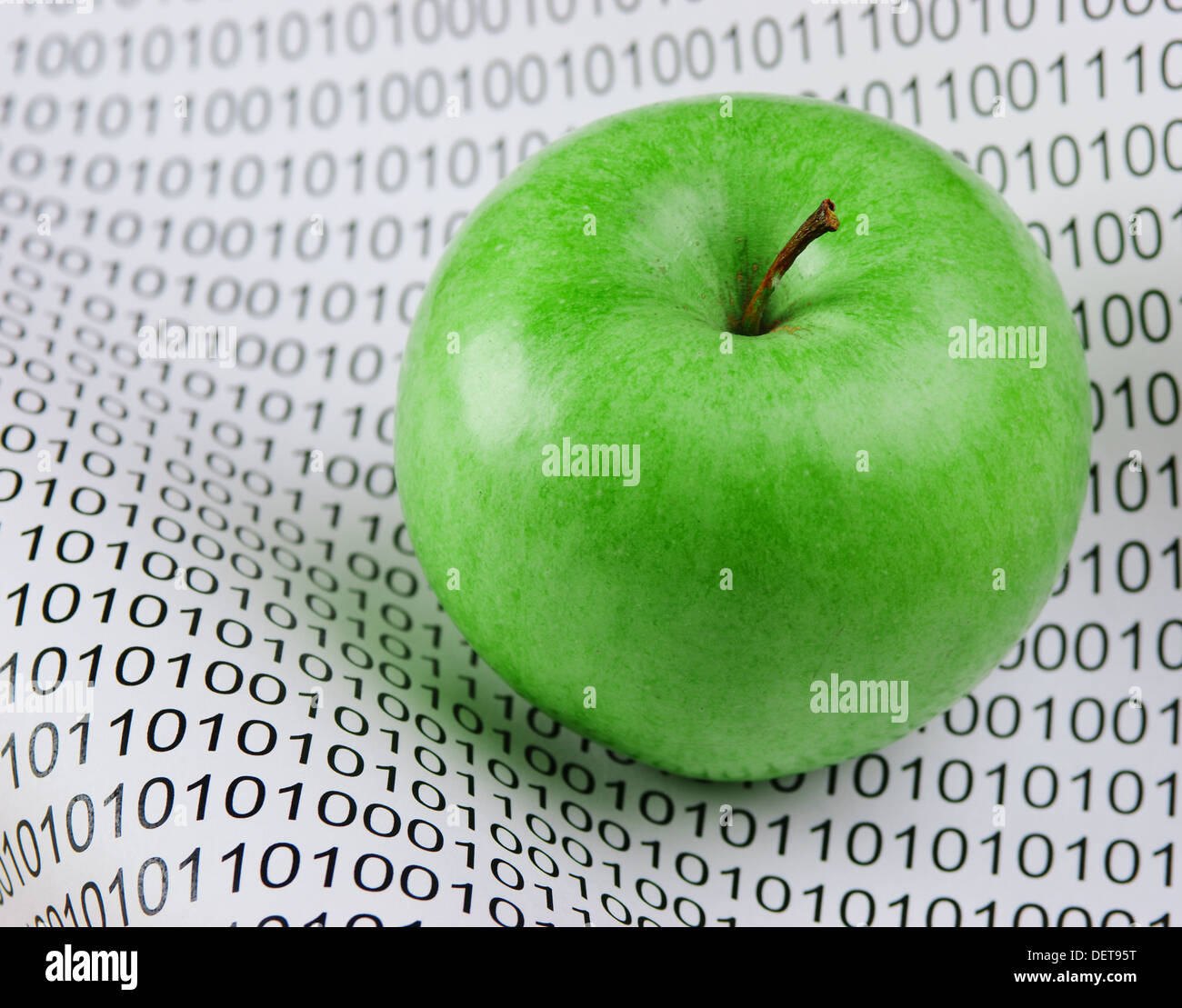 green apple on a binary code Stock Photo - Alamy