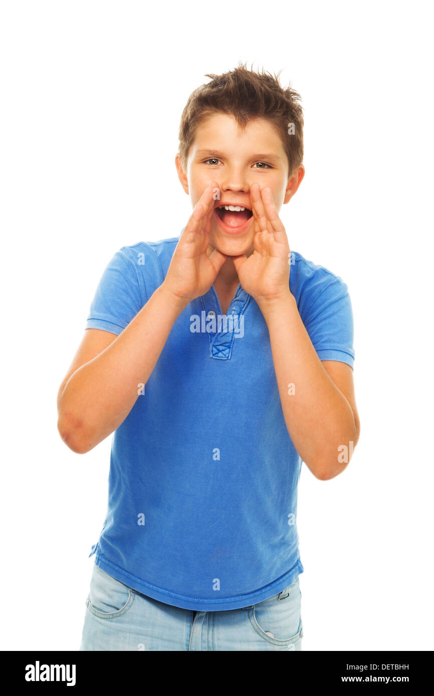 Portrait of happy young boy shouting holding hands near mouth Stock ...