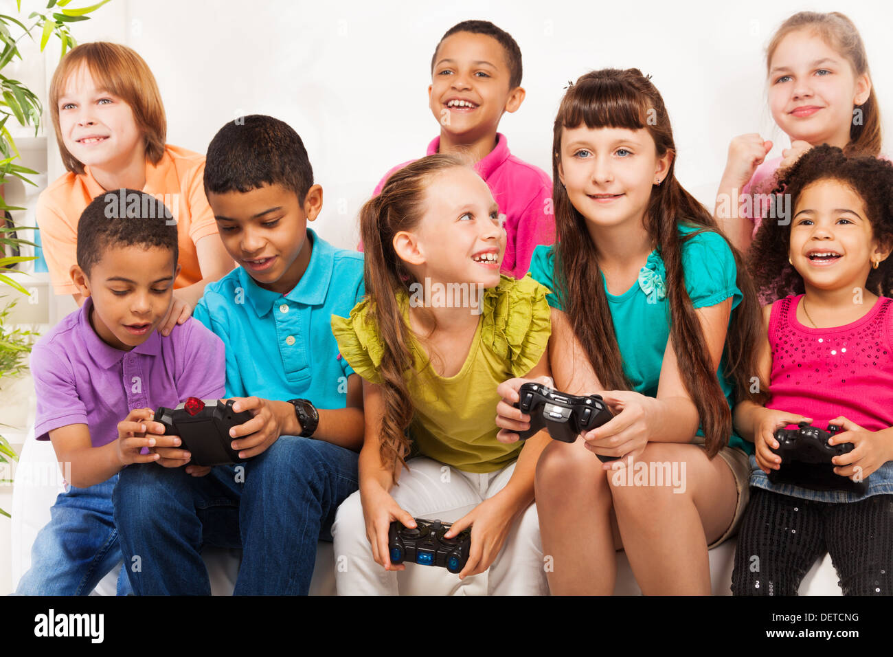 Children friends playing game joystick hi-res stock photography and ...