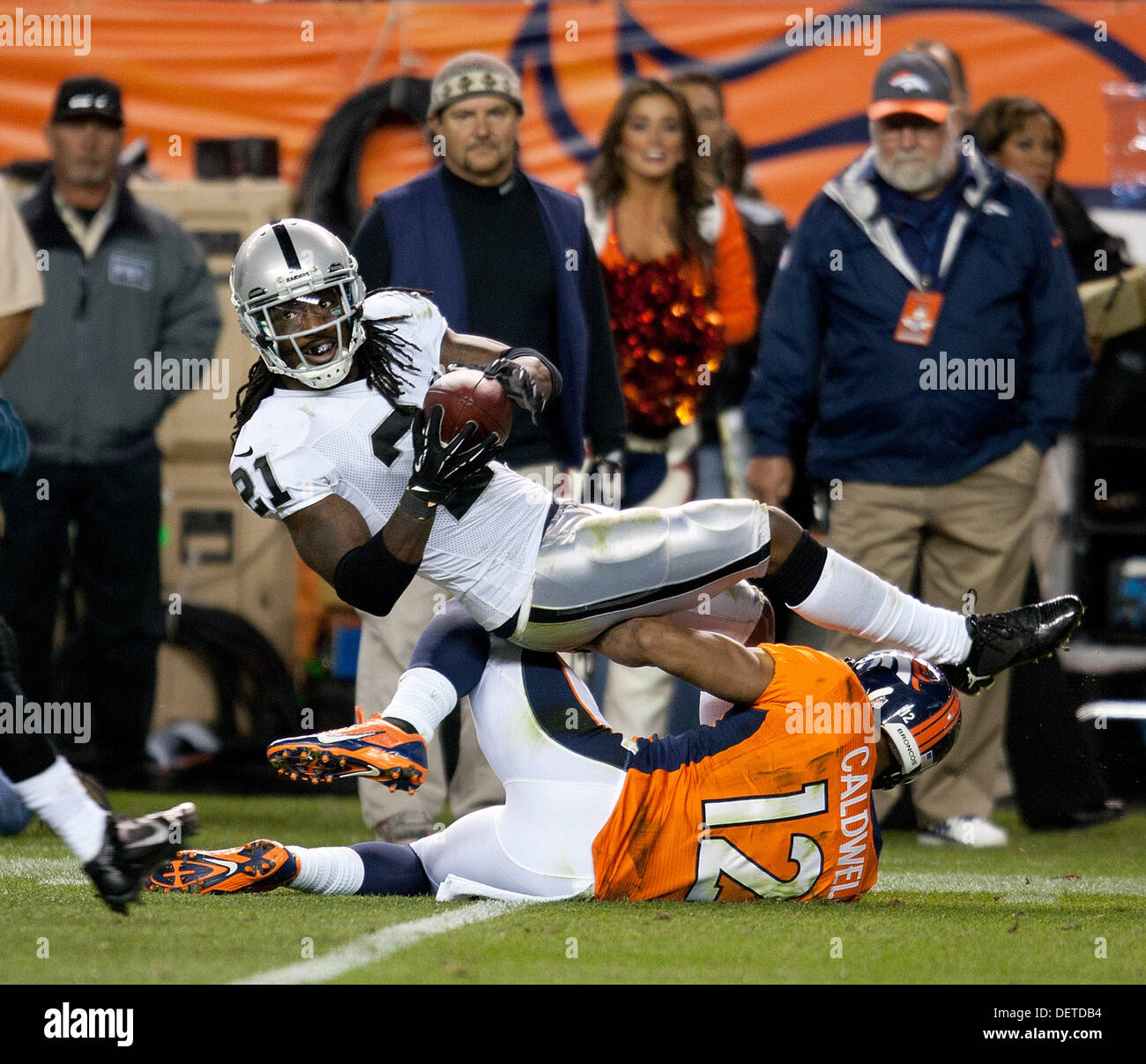 Denver, Colorado, USA. 23rd Sep, 2013. Raiders CB MIKE JENKINS, top ...
