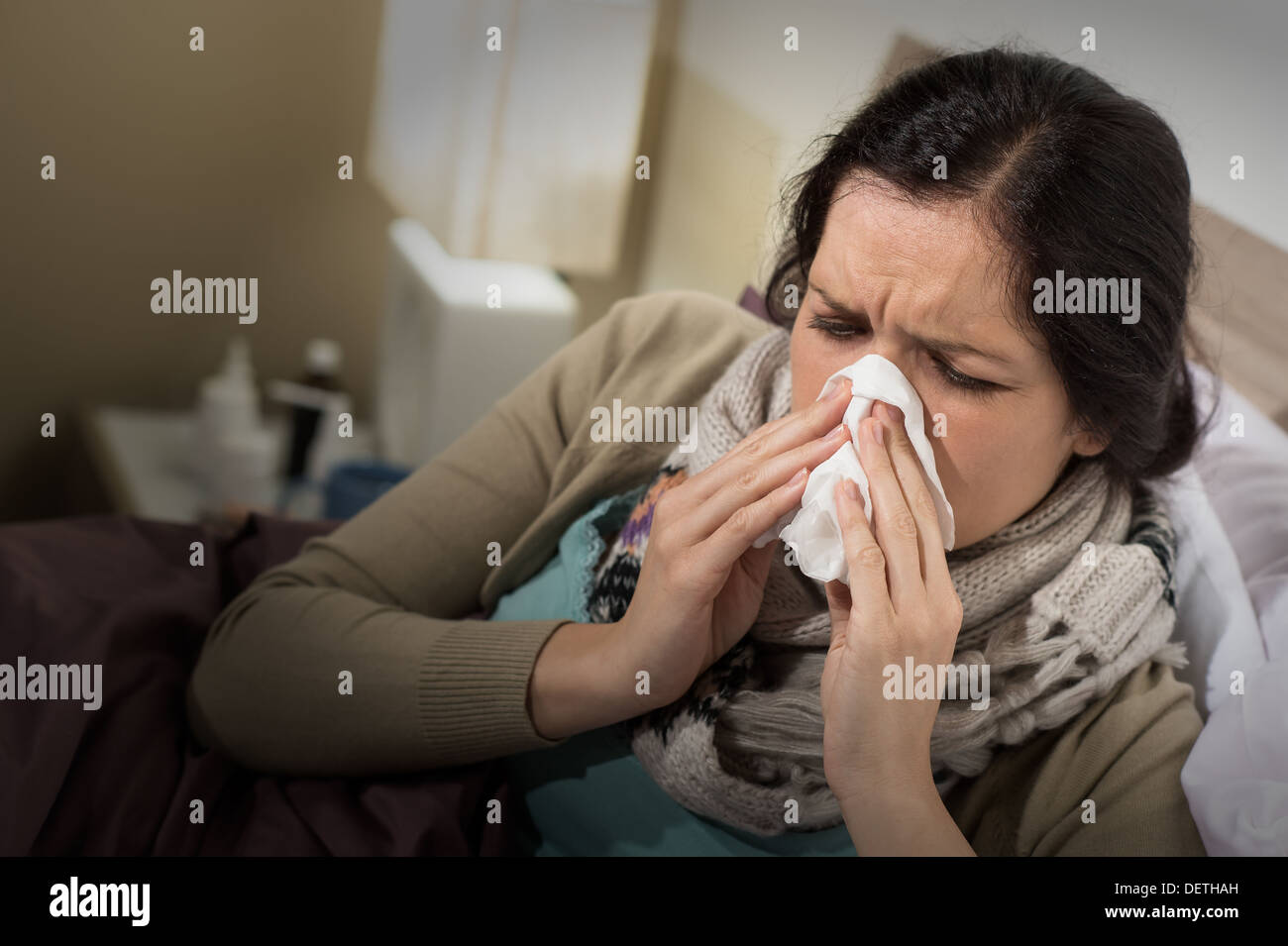 Caucasian woman having bad cold blowing her nose Stock Photo - Alamy