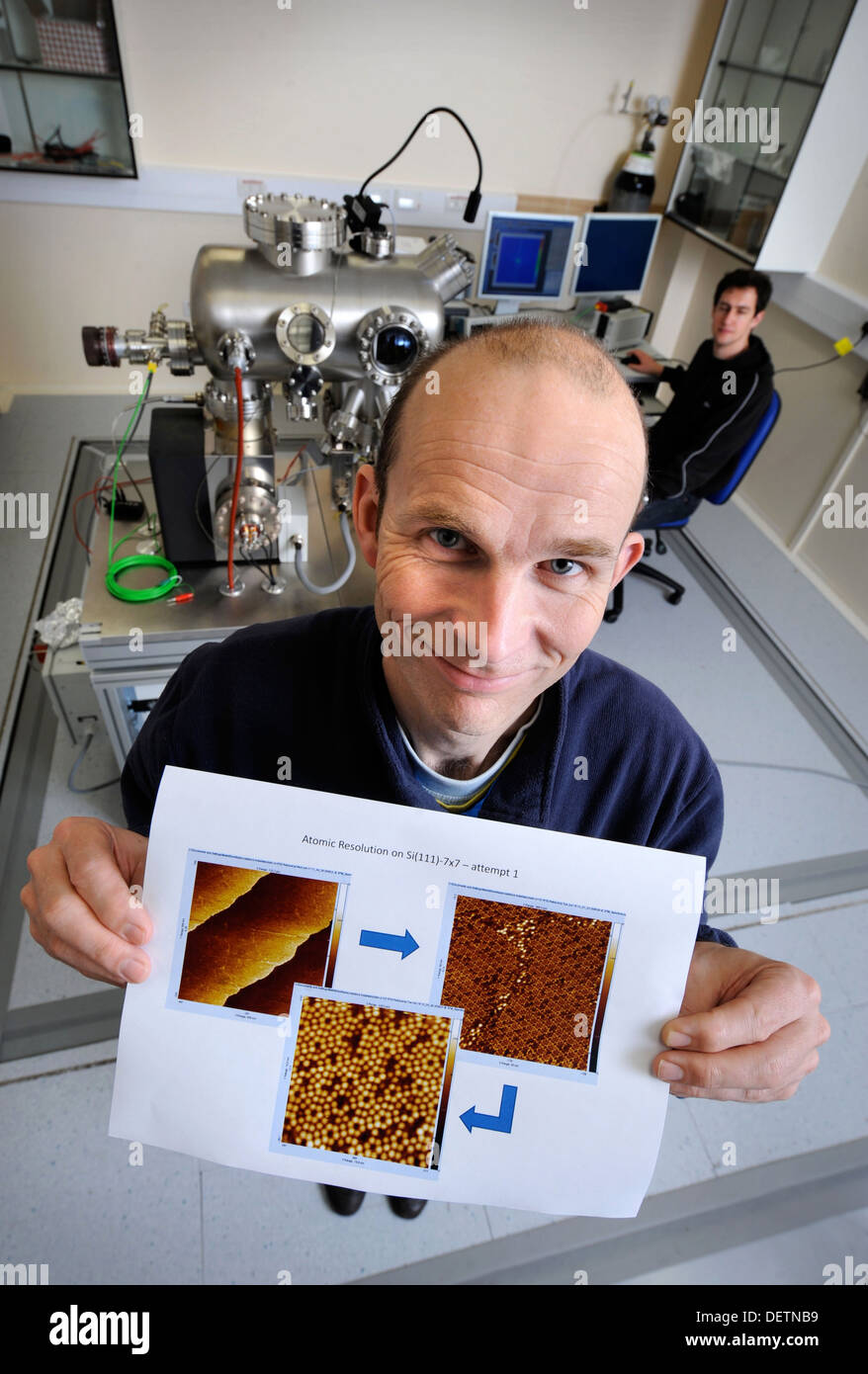 Dr Neil Fox with images showing three levels of magnification of atoms ...