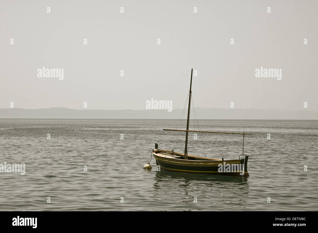 Fishing boat with a mast in sea Stock Photo - Alamy