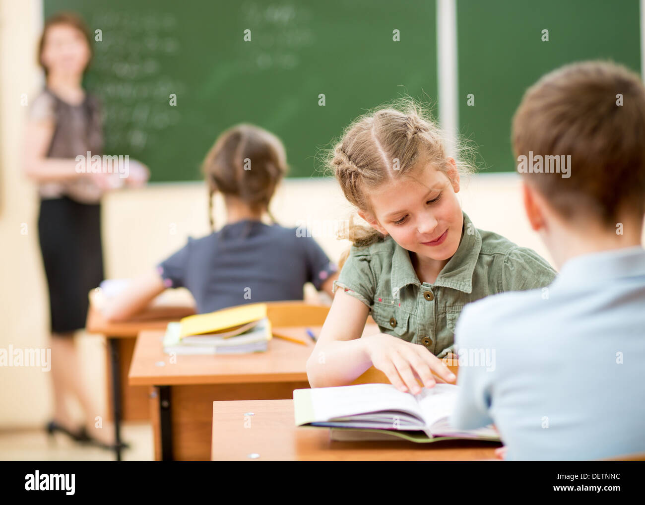 Schoolgirl with teacher hi-res stock photography and images - Alamy