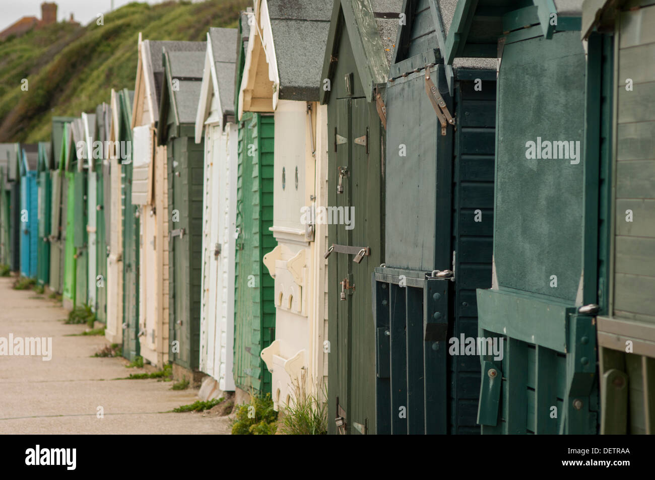 row of weathered beach huts Stock Photo - Alamy