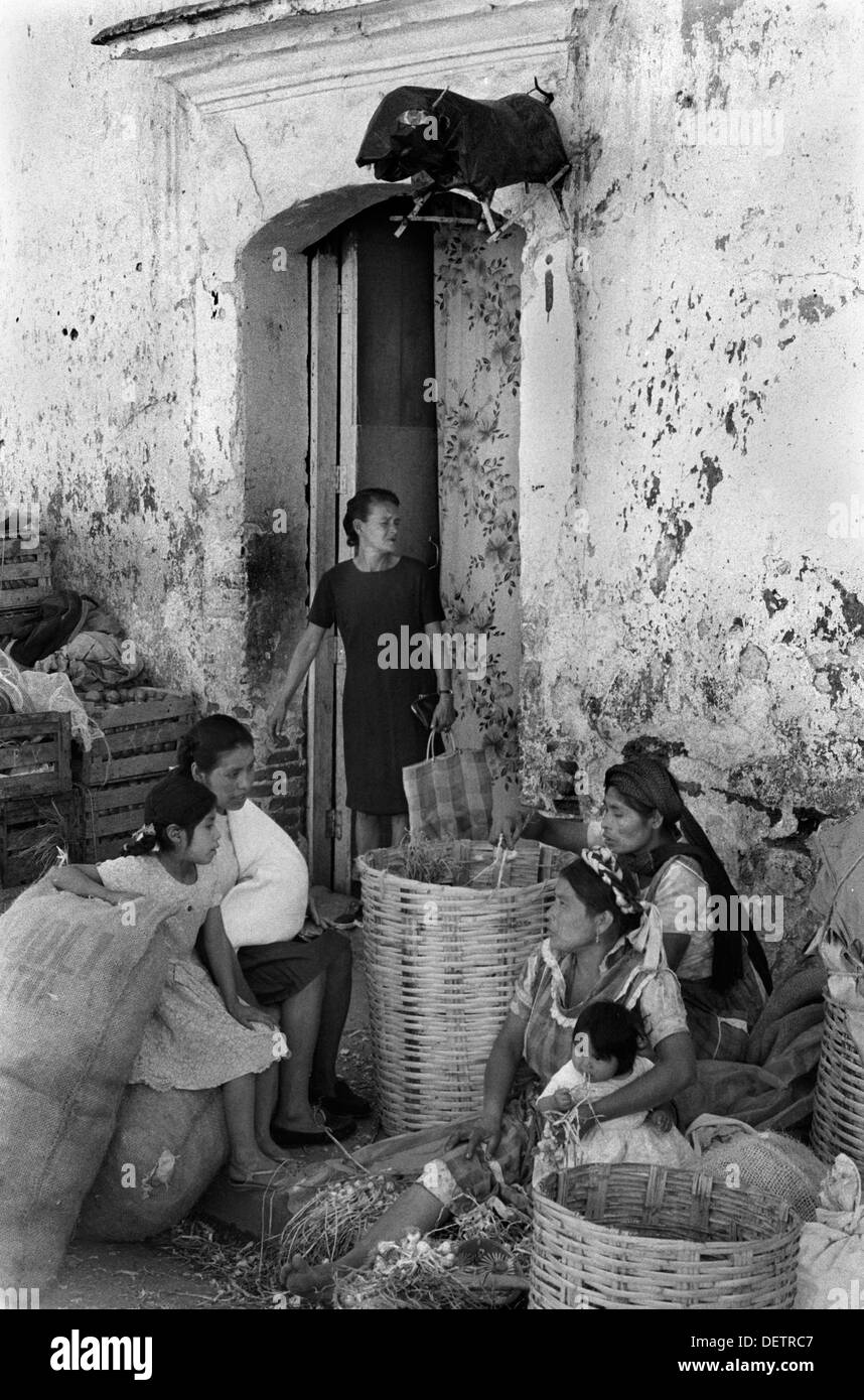 Oaxaca, Mexico 1970s Mexican indian women sit below a hand crafted Bull ...
