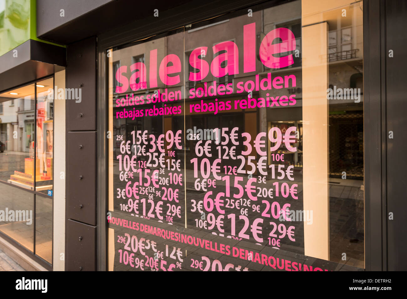 Sale sign on shop window, France Stock Photo - Alamy