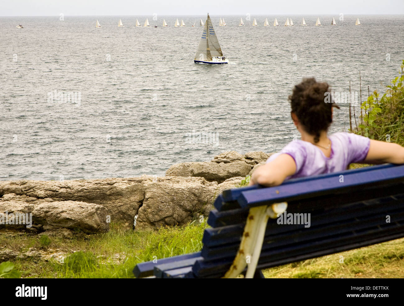 Woman watching sailing boats hi-res stock photography and images - Alamy