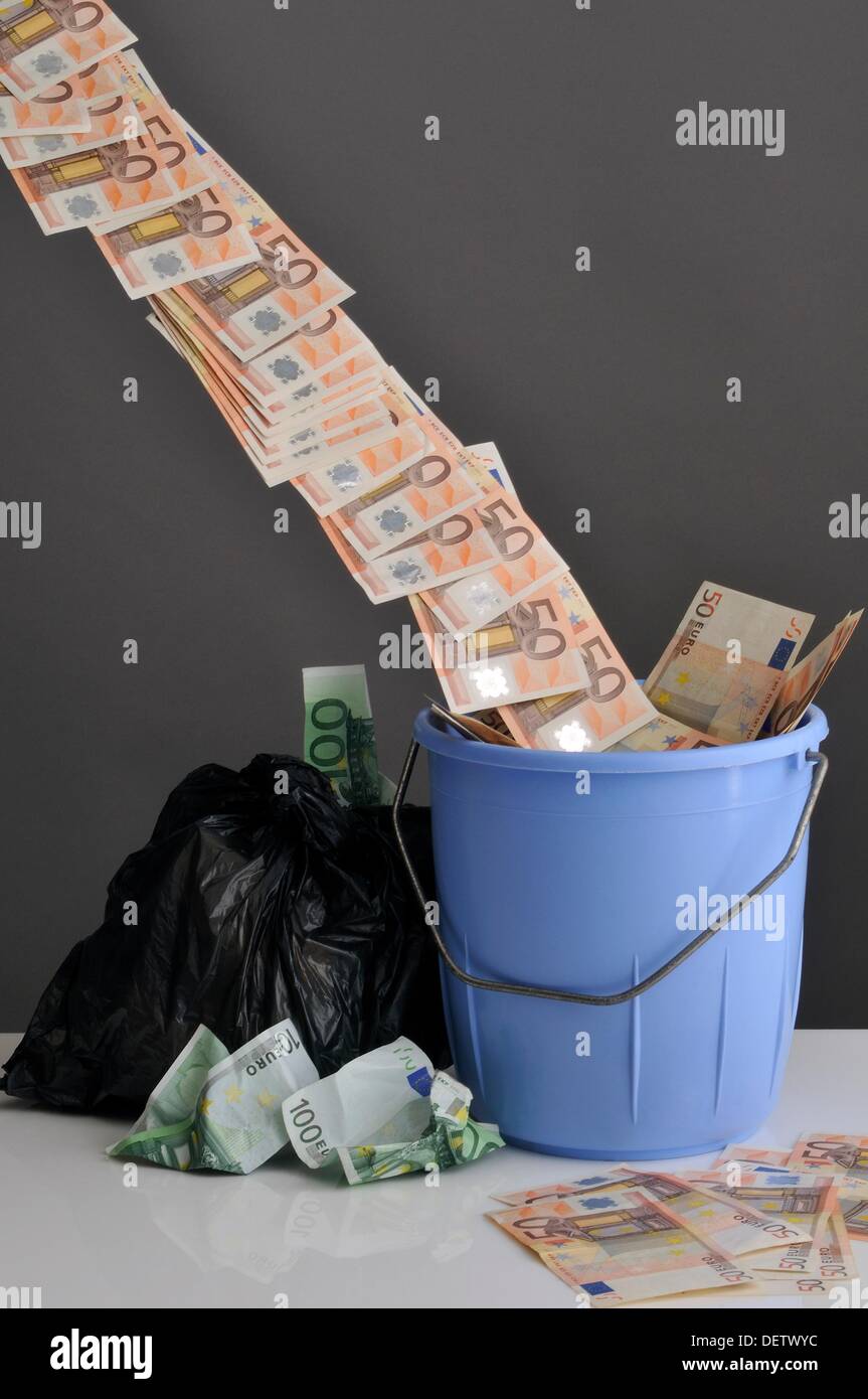 Money down drain hi-res stock photography and images - Alamy