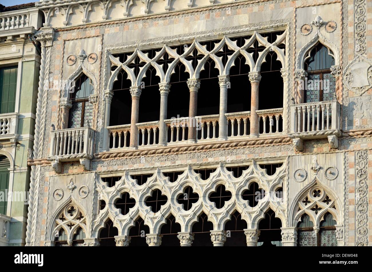 Sculpted building facade with columns in Venice, Italy Stock Photo - Alamy