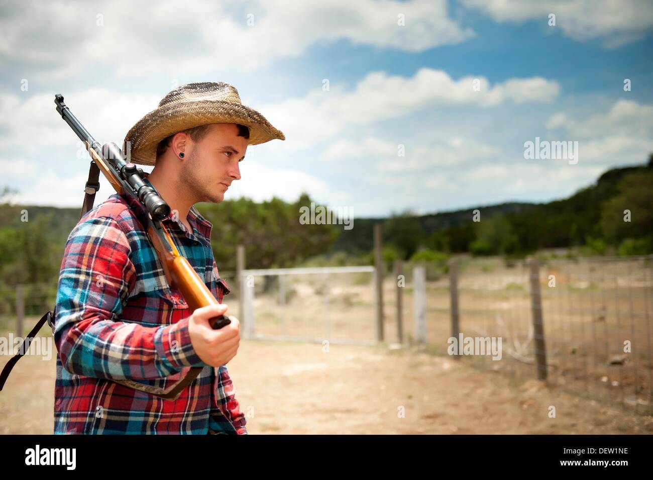 Cowboy with rifle hi-res stock photography and images - Alamy