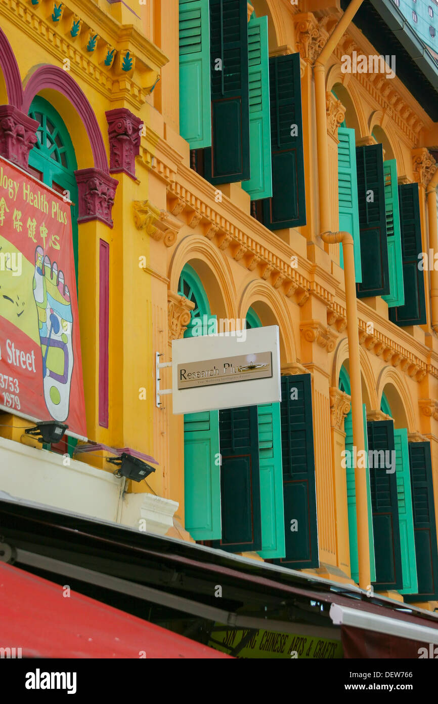 Yellow house building with Green shutters in Singapore Stock Photo - Alamy