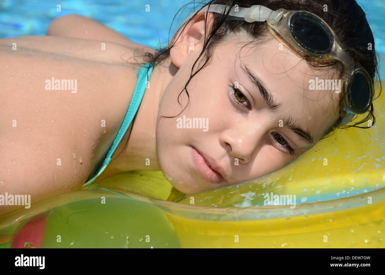 Teenager floats in pool hi-res stock photography and images - Alamy