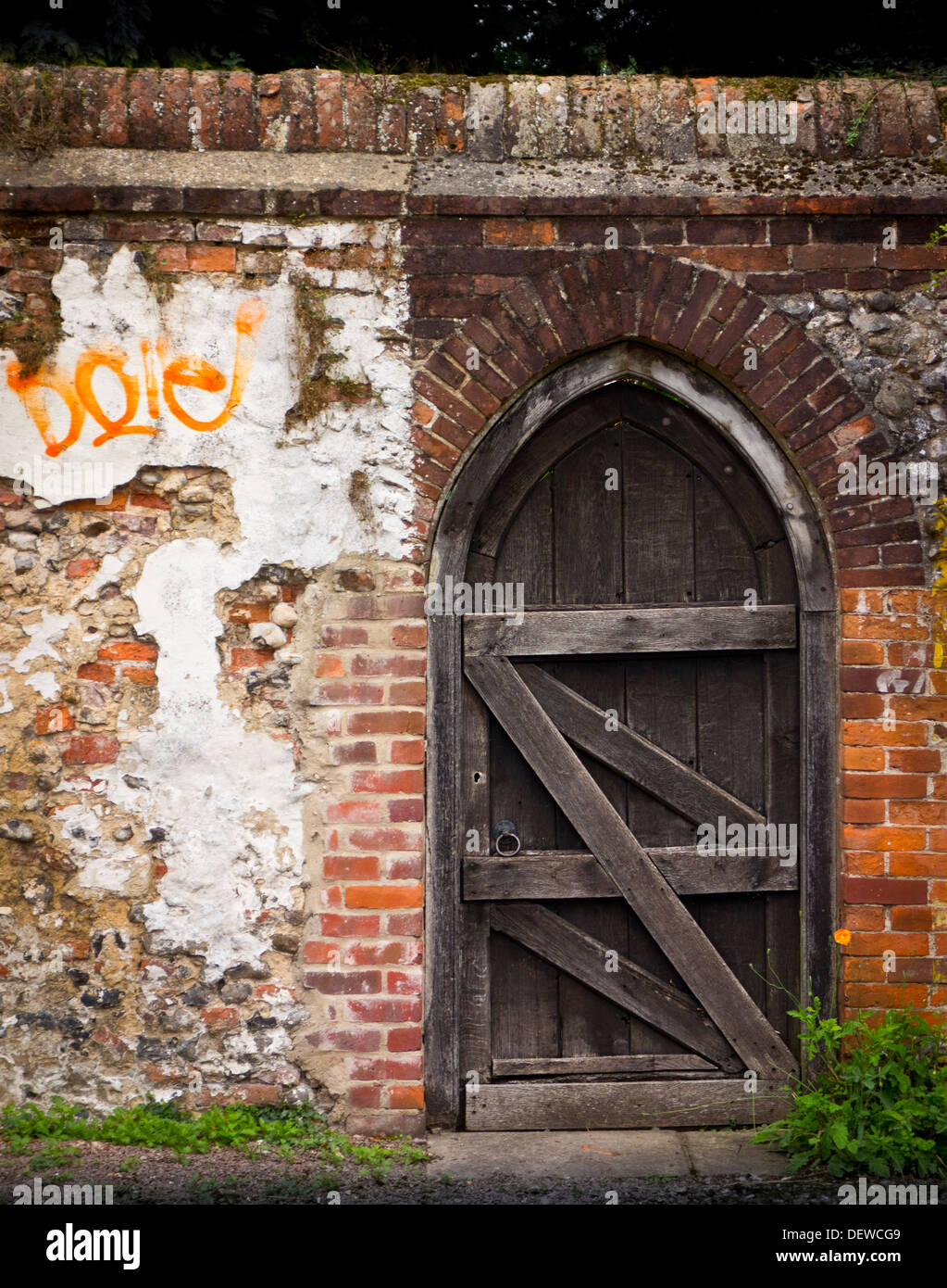 Old wooden gate in garden wall hi-res stock photography and images - Alamy