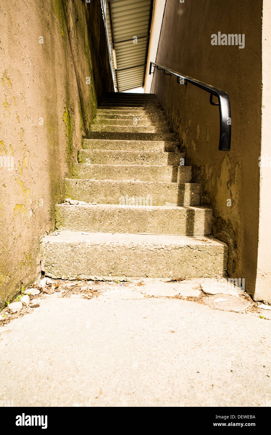 Old concrete stairs between two walls Stock Photo - Alamy