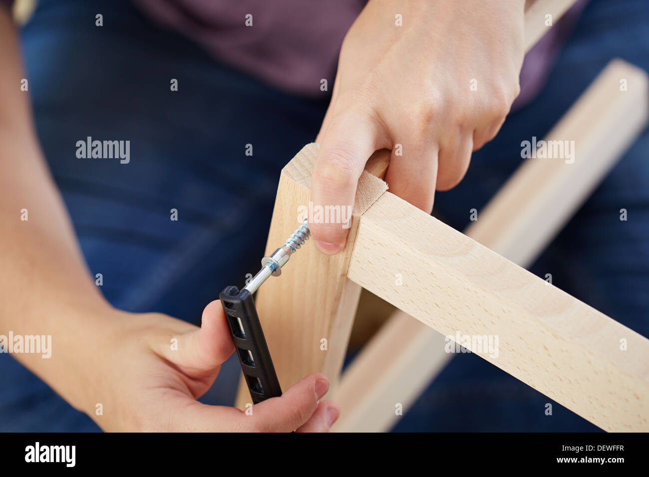 Assembling a piece of furniture hi-res stock photography and images - Alamy