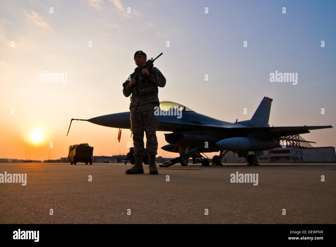 U.S. Air Force Airman First Class Brett Behrens provides flight line ...