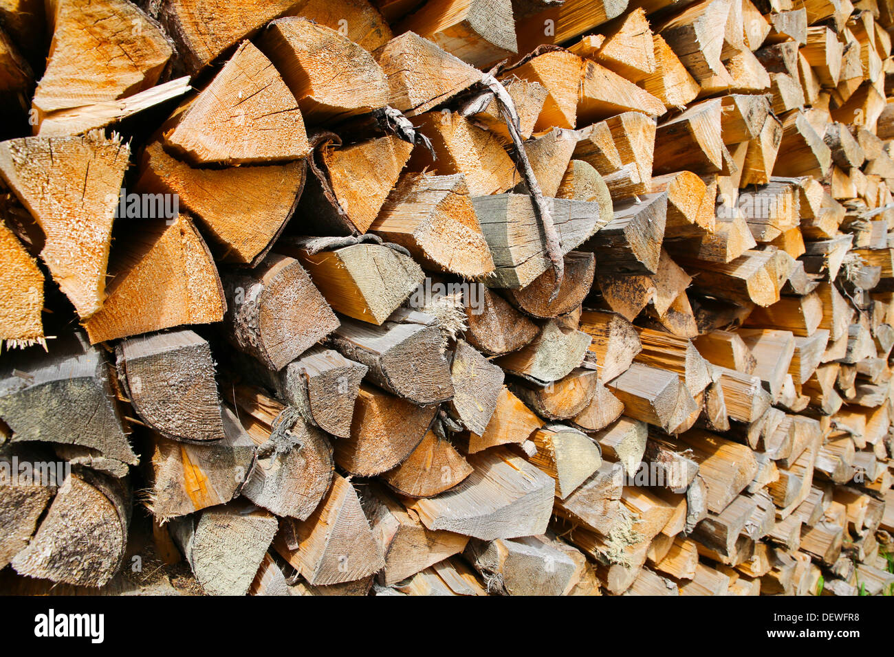 Stacked up fire wood background Stock Photo - Alamy