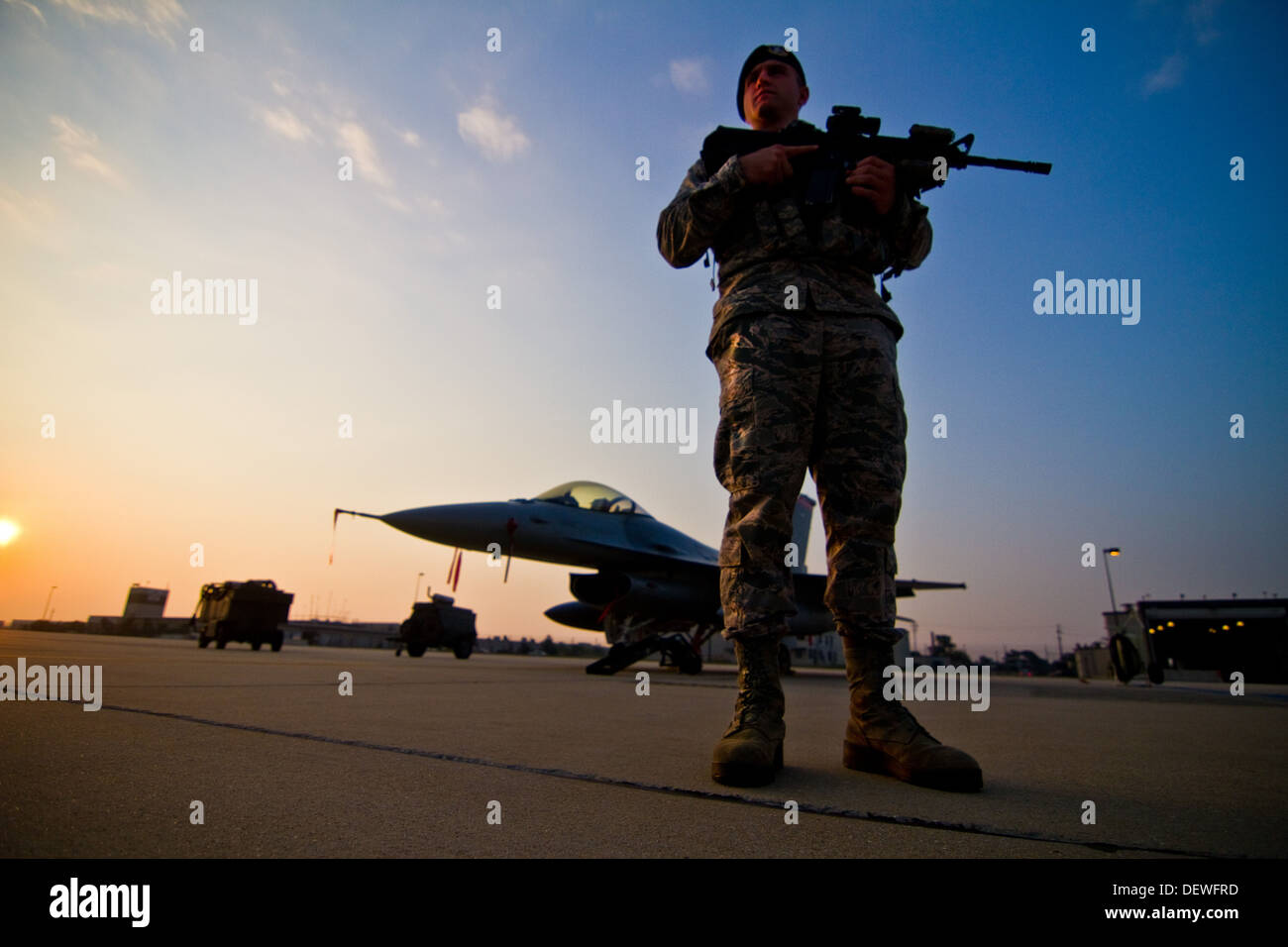 U.S. Air Force Airman First Class Brett Behrens provides flight line ...